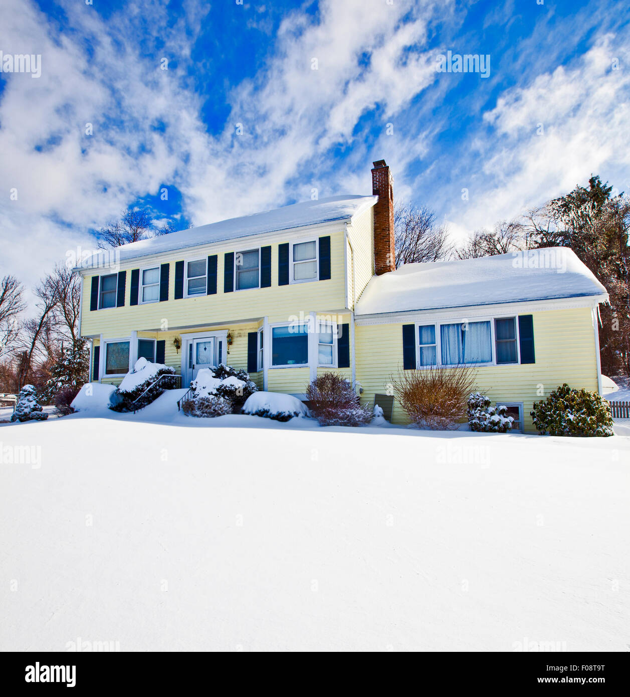 Typical colonial style house in deep snow and ice Stock Photo - Alamy