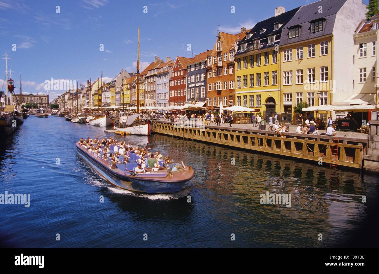 Excursion boat Hustle and bustle at Nyhavn in Copenhagen, Denmark Stock ...
