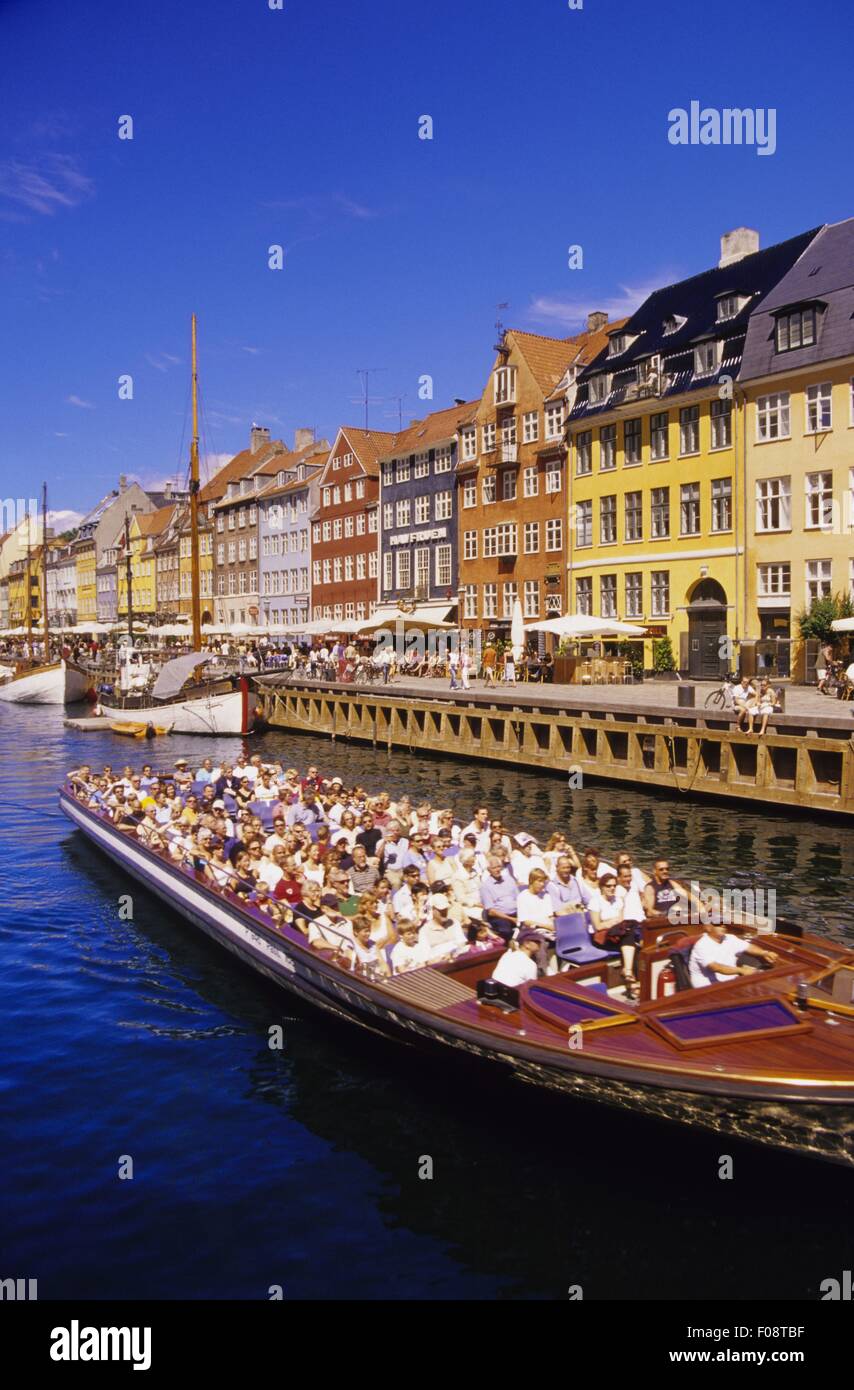 Excursion boat Hustle and bustle at Nyhavn in Copenhagen, Denmark Stock ...