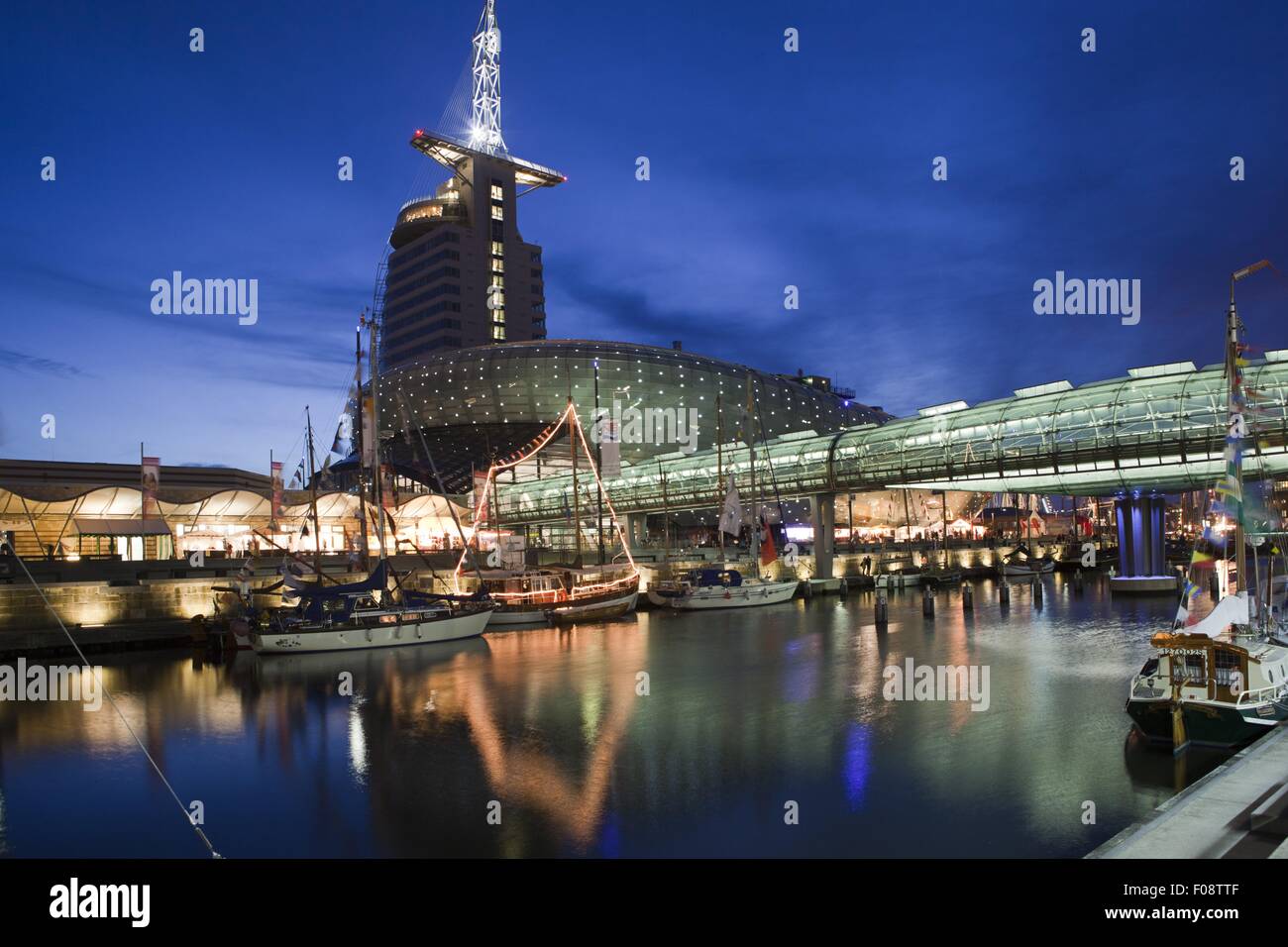 Night view of climate house at old port with moored boats in ...