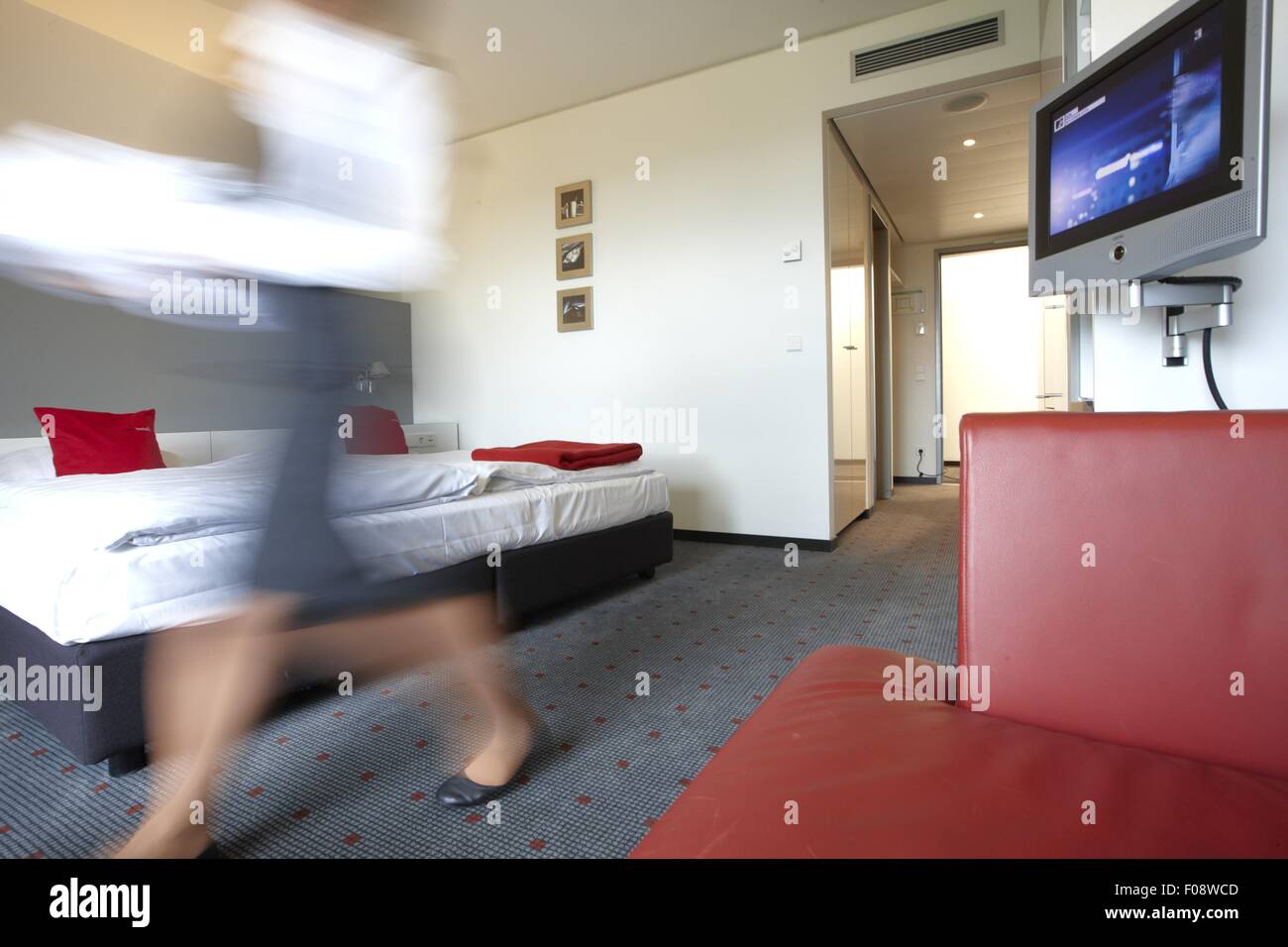 Housekeeper at room in hotel at Vaihingen, Stuttgart, Baden-Wurttemberg ...