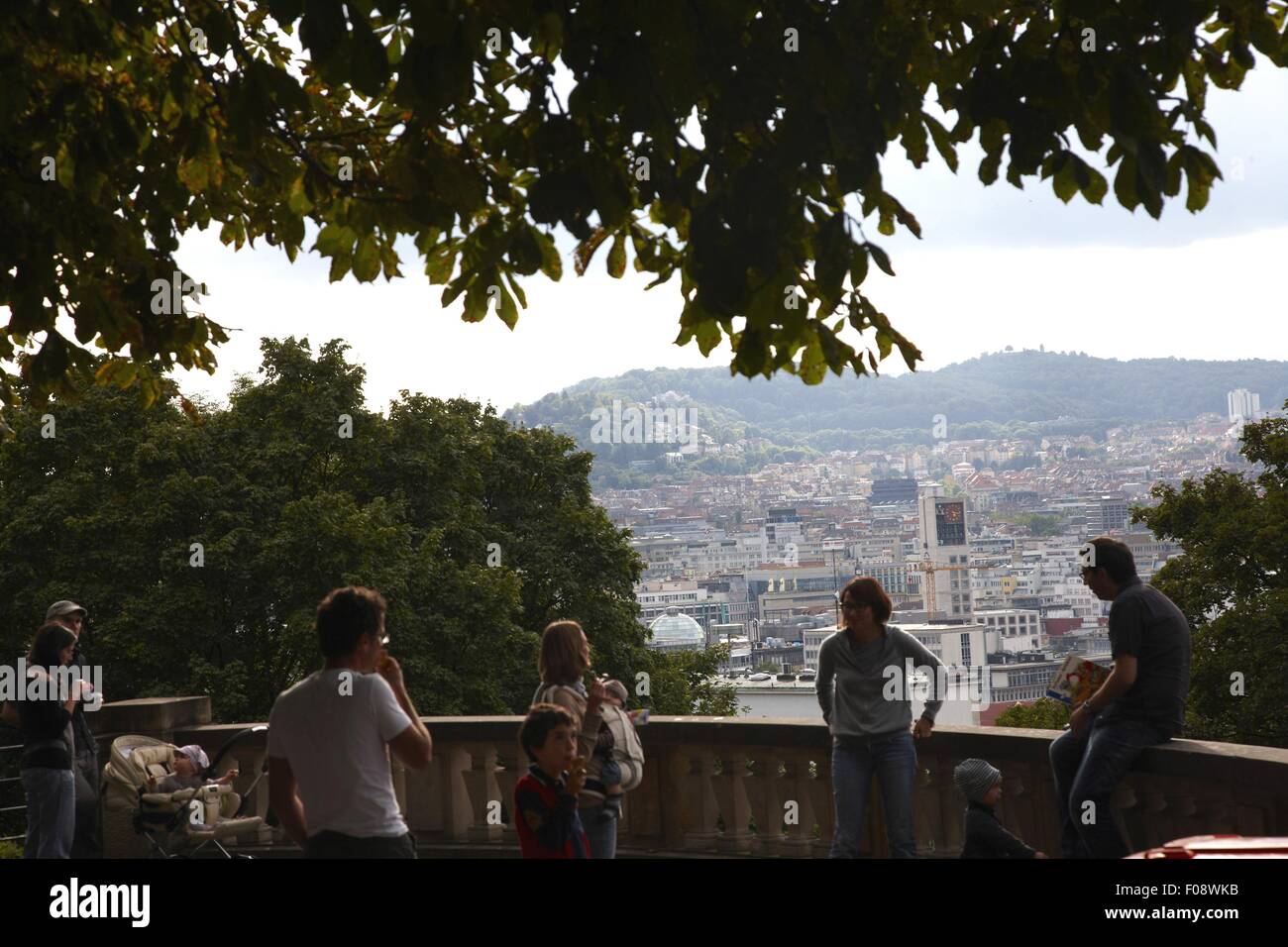 View of city of Stuttgart overlooking tourists standing on Eugensplatz ...