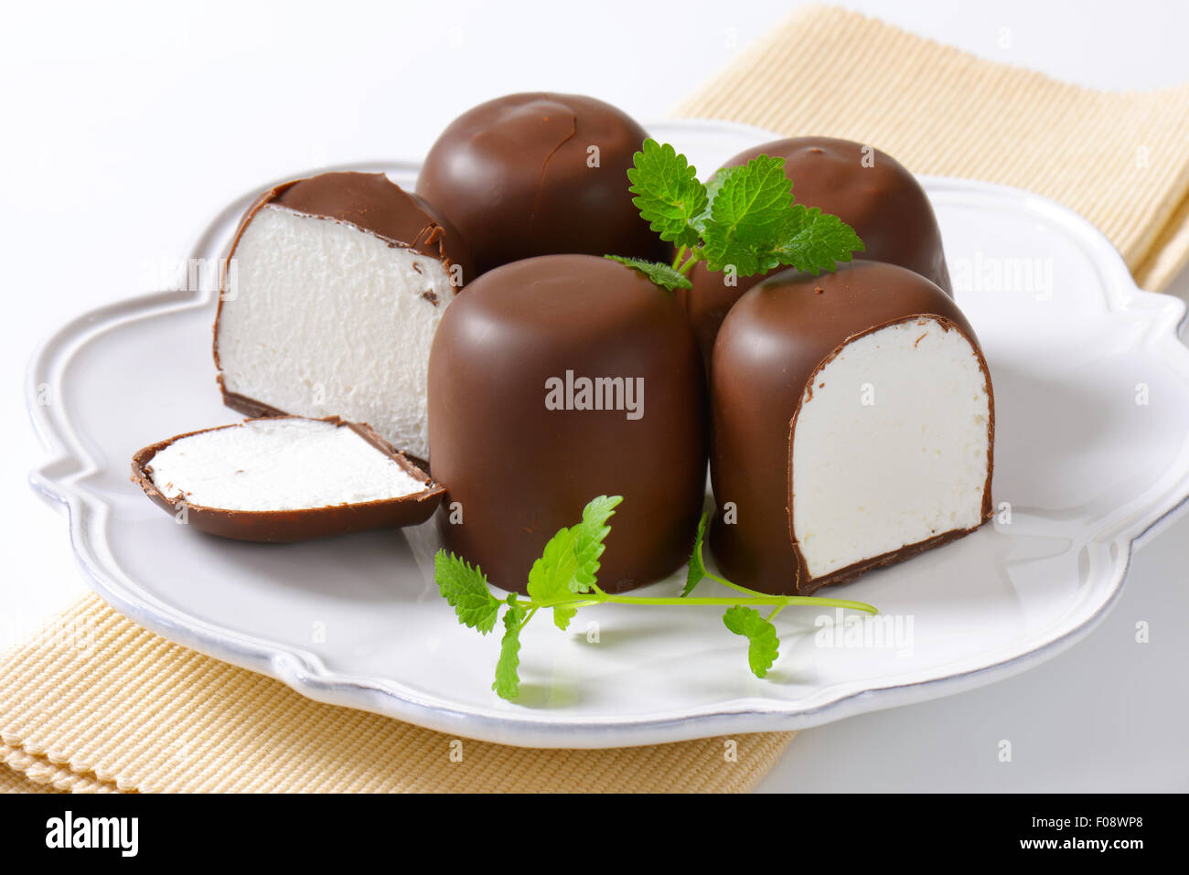 Marshmallows coated in milk chocolate Stock Photo - Alamy