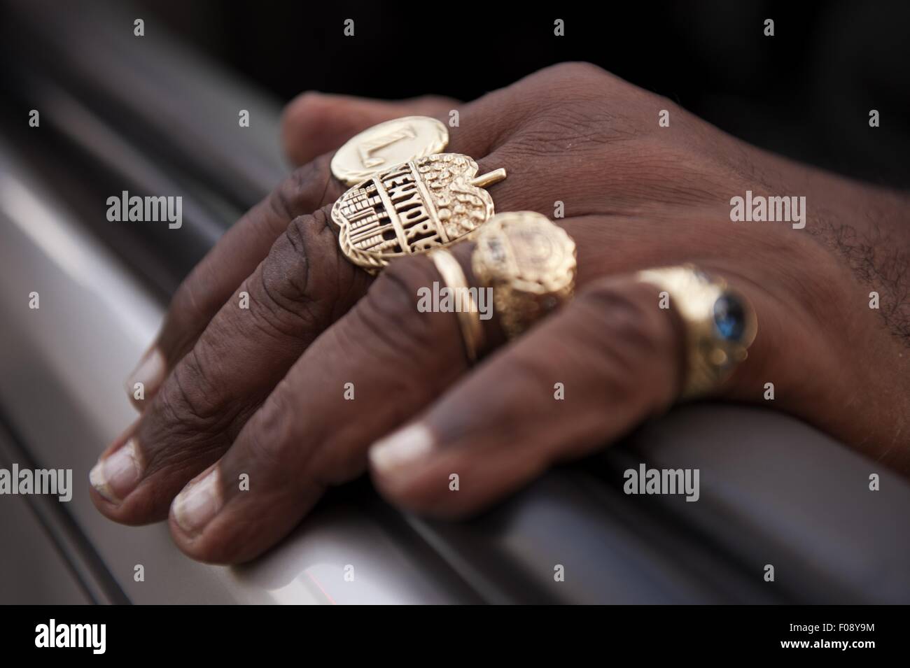Close-up of man's hand wearing gold rings in New York, USA Stock Photo ...