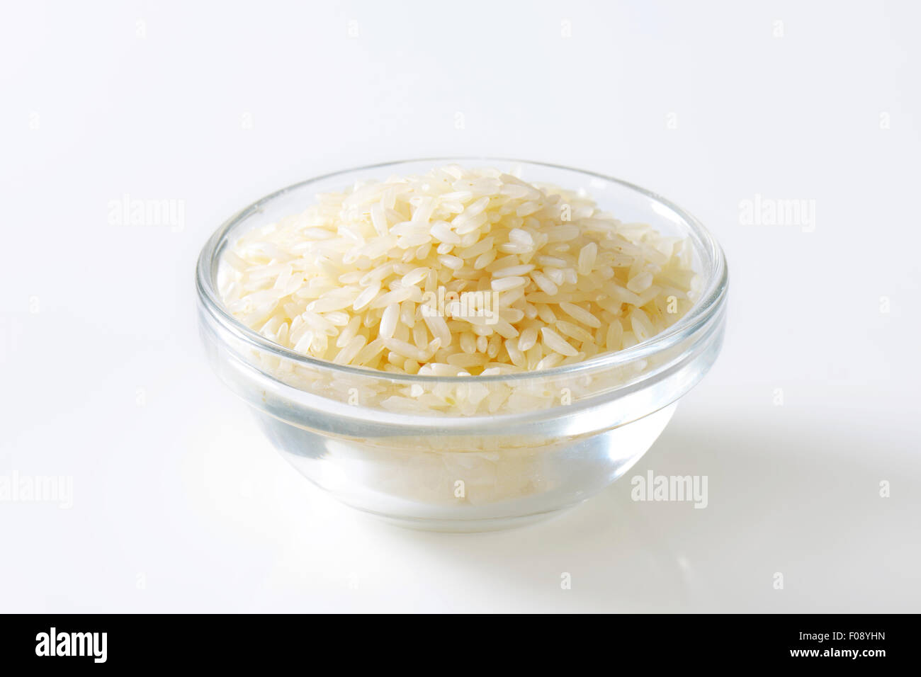 Bowl of uncooked white rice Stock Photo - Alamy