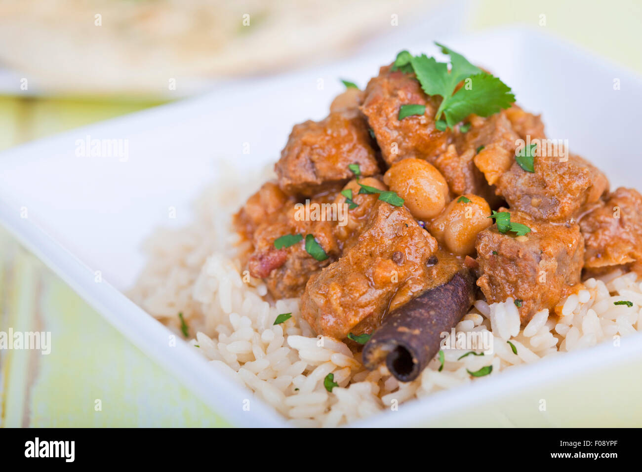 Beef curry served on a bed of rice Stock Photo - Alamy