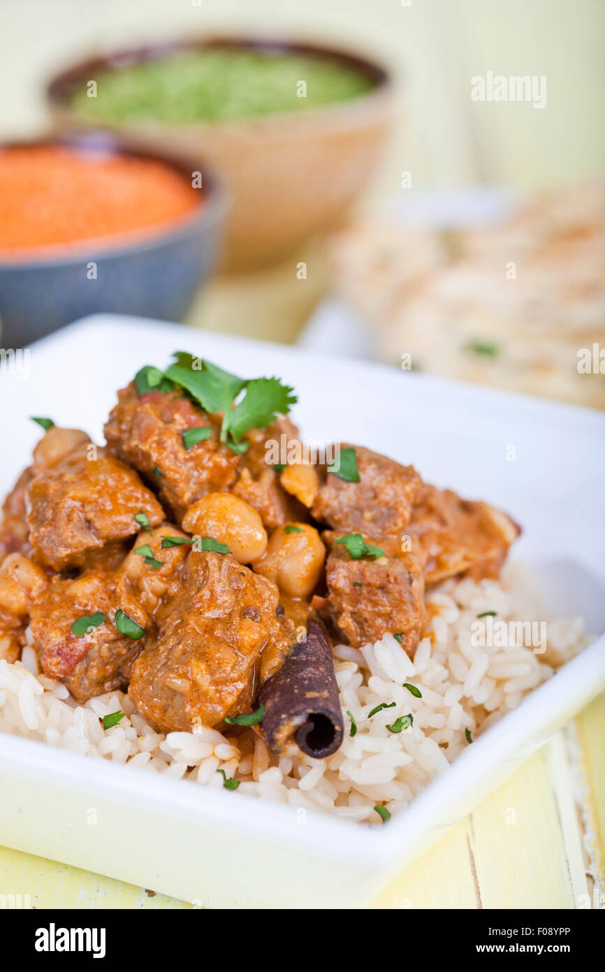 Beef curry served on a bed of rice Stock Photo - Alamy
