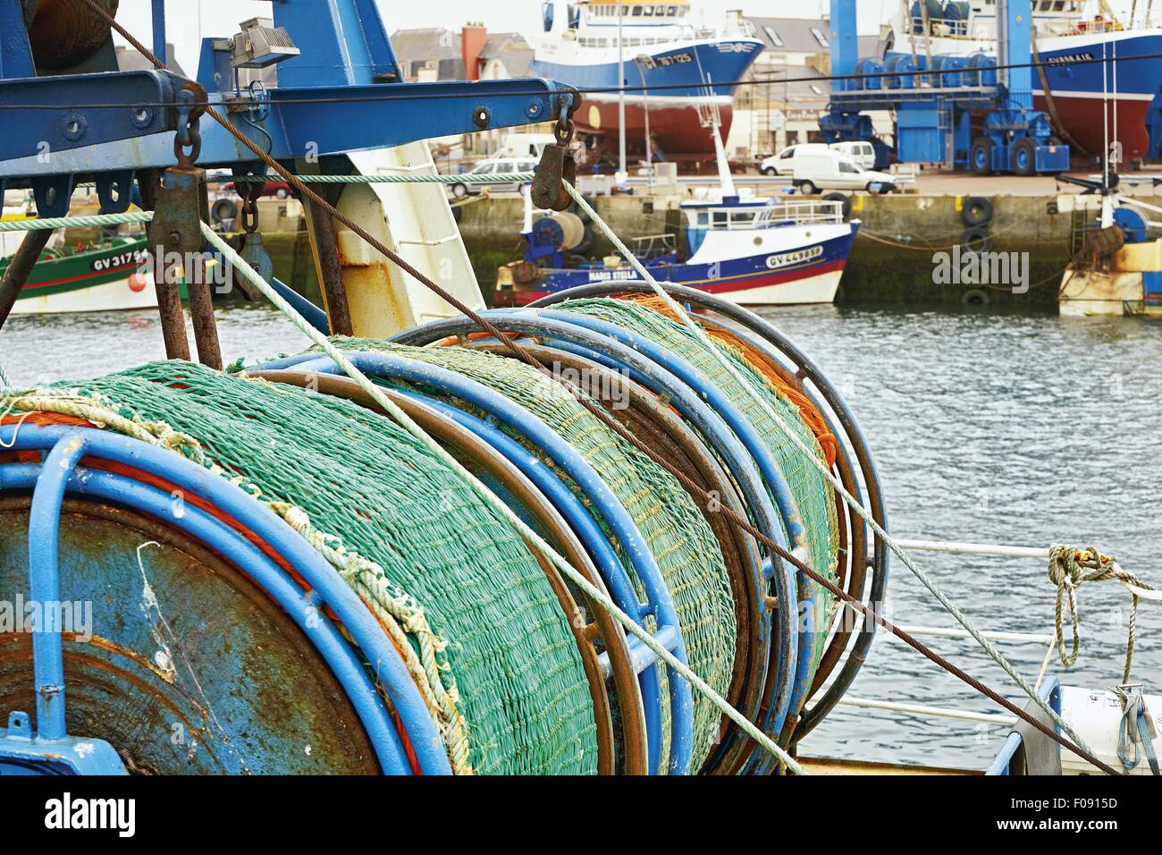 Ships and trawls on French harbour Stock Photo - Alamy