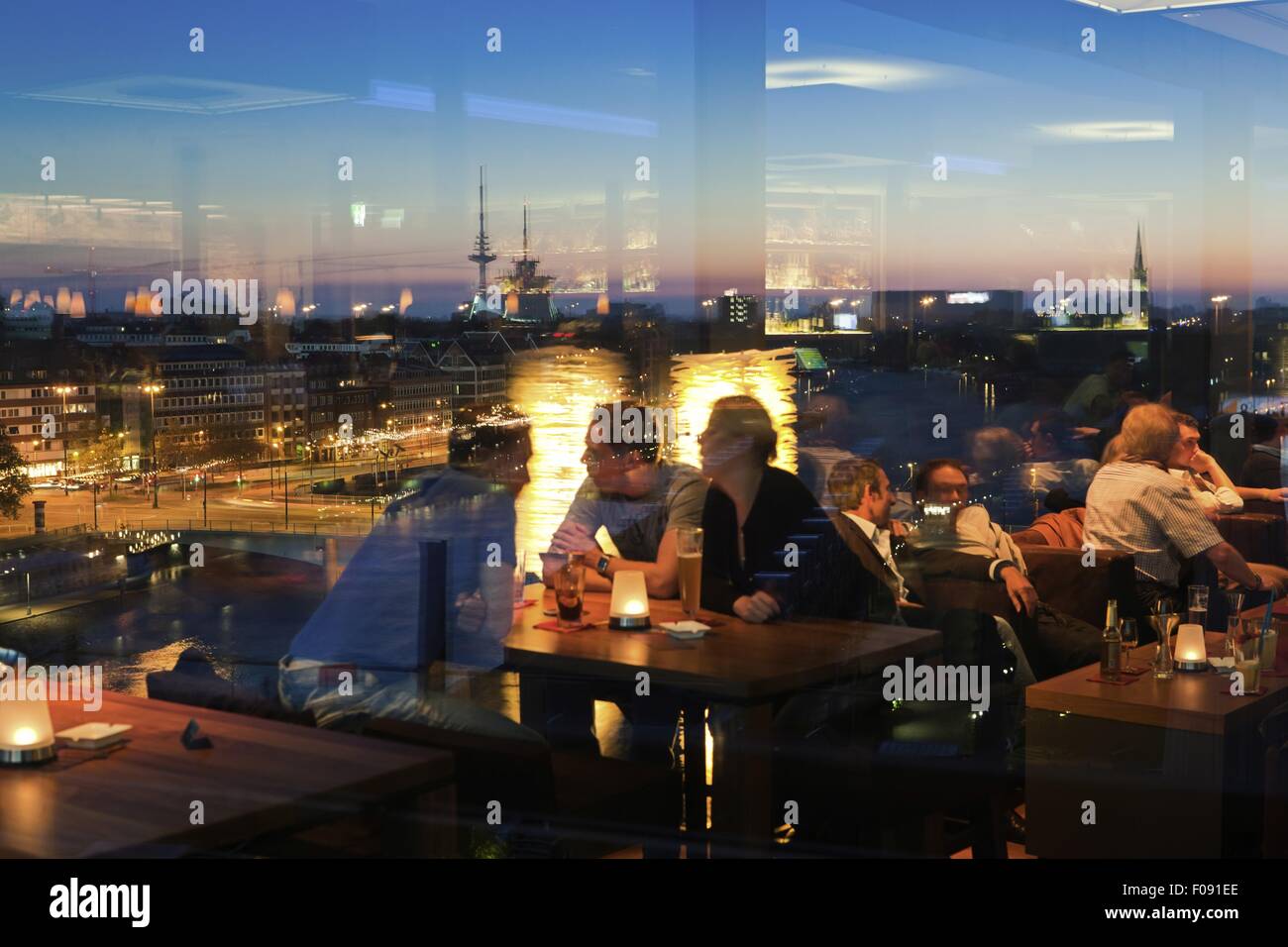 People dinning at roadside restaurant at night, Bremen, Germany Stock ...