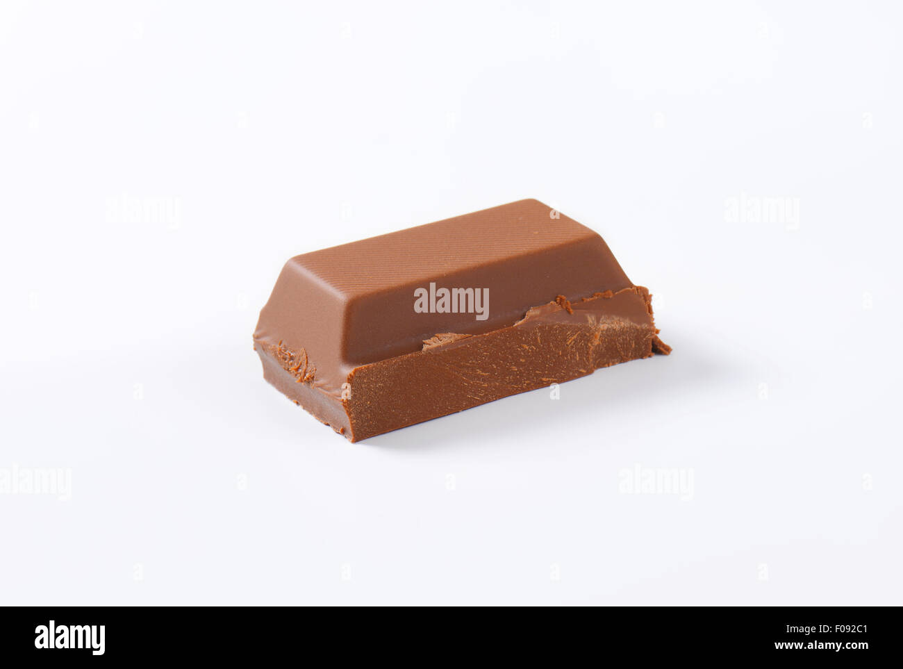 single piece of milk chocolate Stock Photo - Alamy