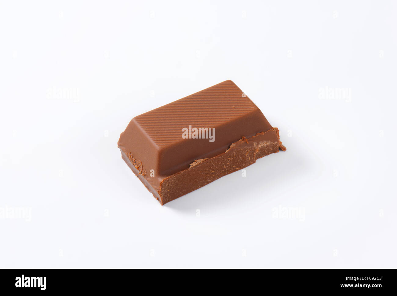 single piece of milk chocolate Stock Photo - Alamy