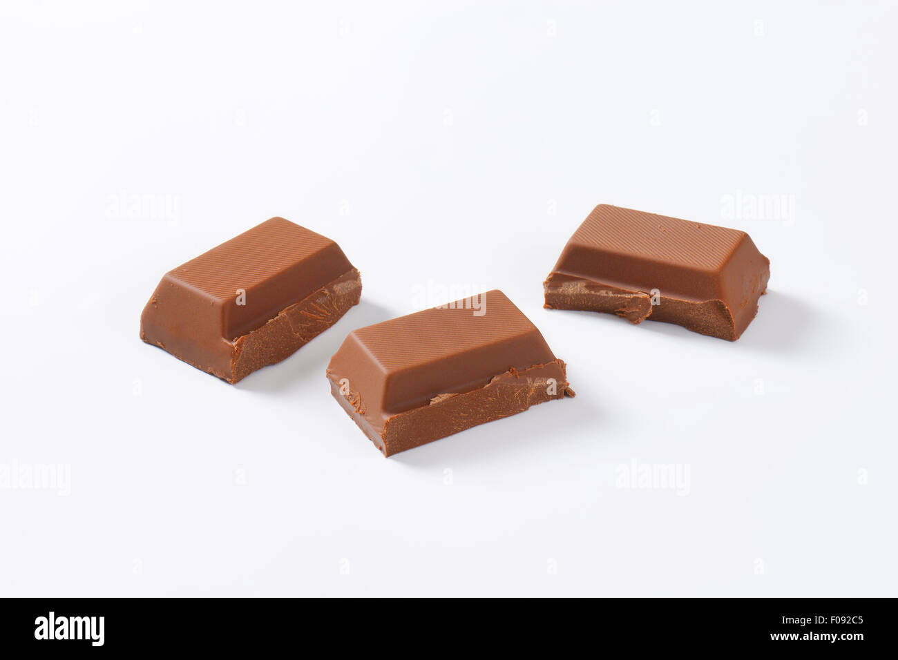 three piece of milk chocolate bar Stock Photo - Alamy