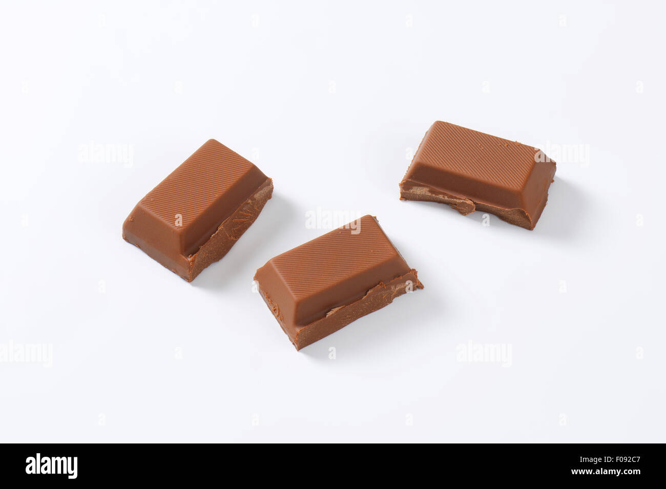 three piece of milk chocolate bar Stock Photo - Alamy