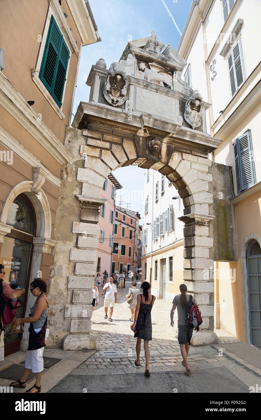 People walking at old town Balbi Arch in Rovinj, Croatia Stock Photo ...