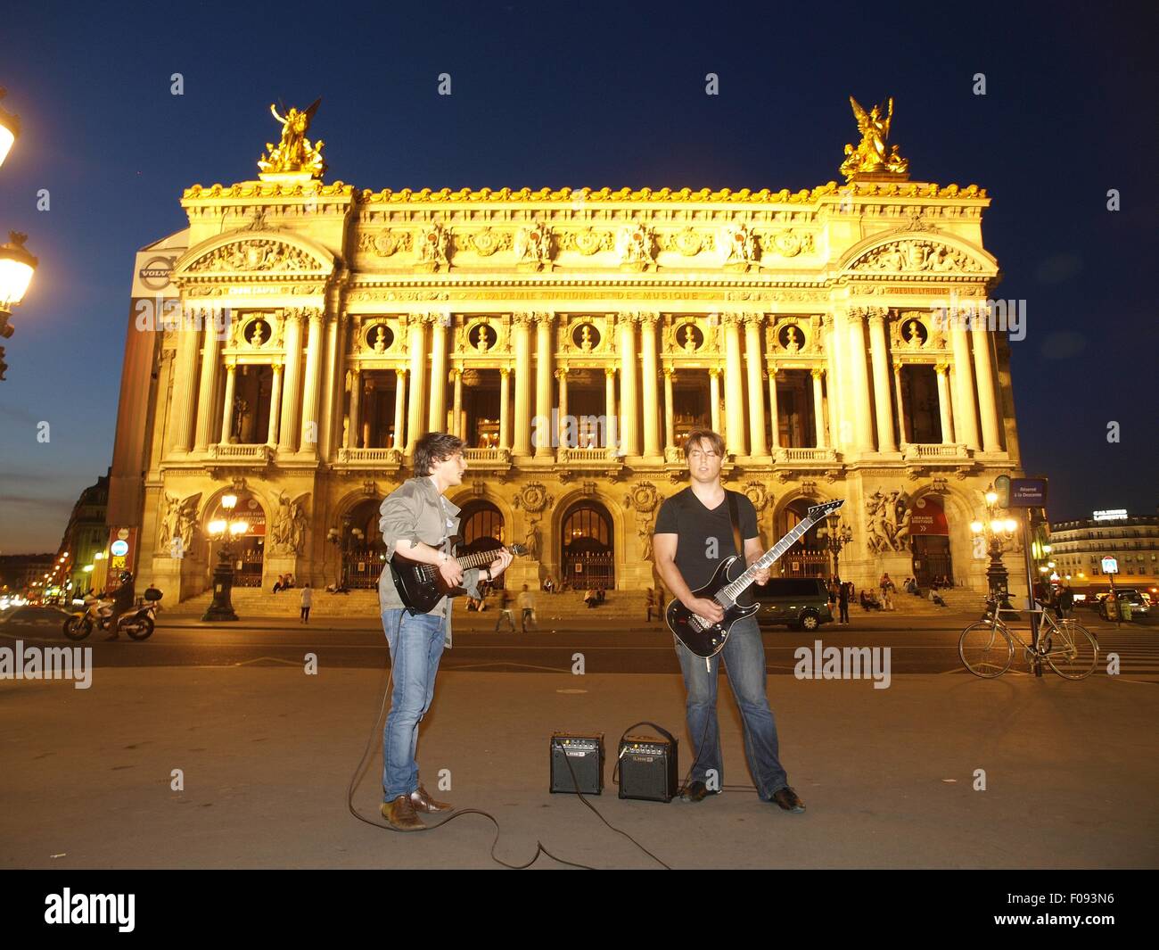 Two musicians performing in front of Opera Garnier, Paris, France Stock ...