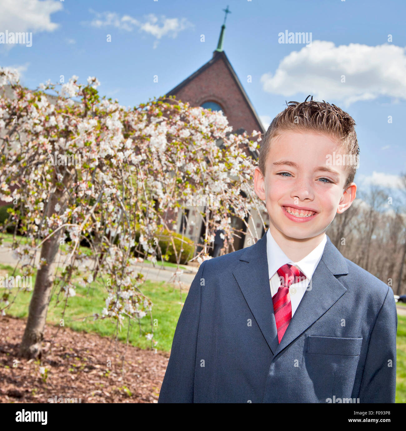 Young handsome boy standing outside a church Stock Photo - Alamy