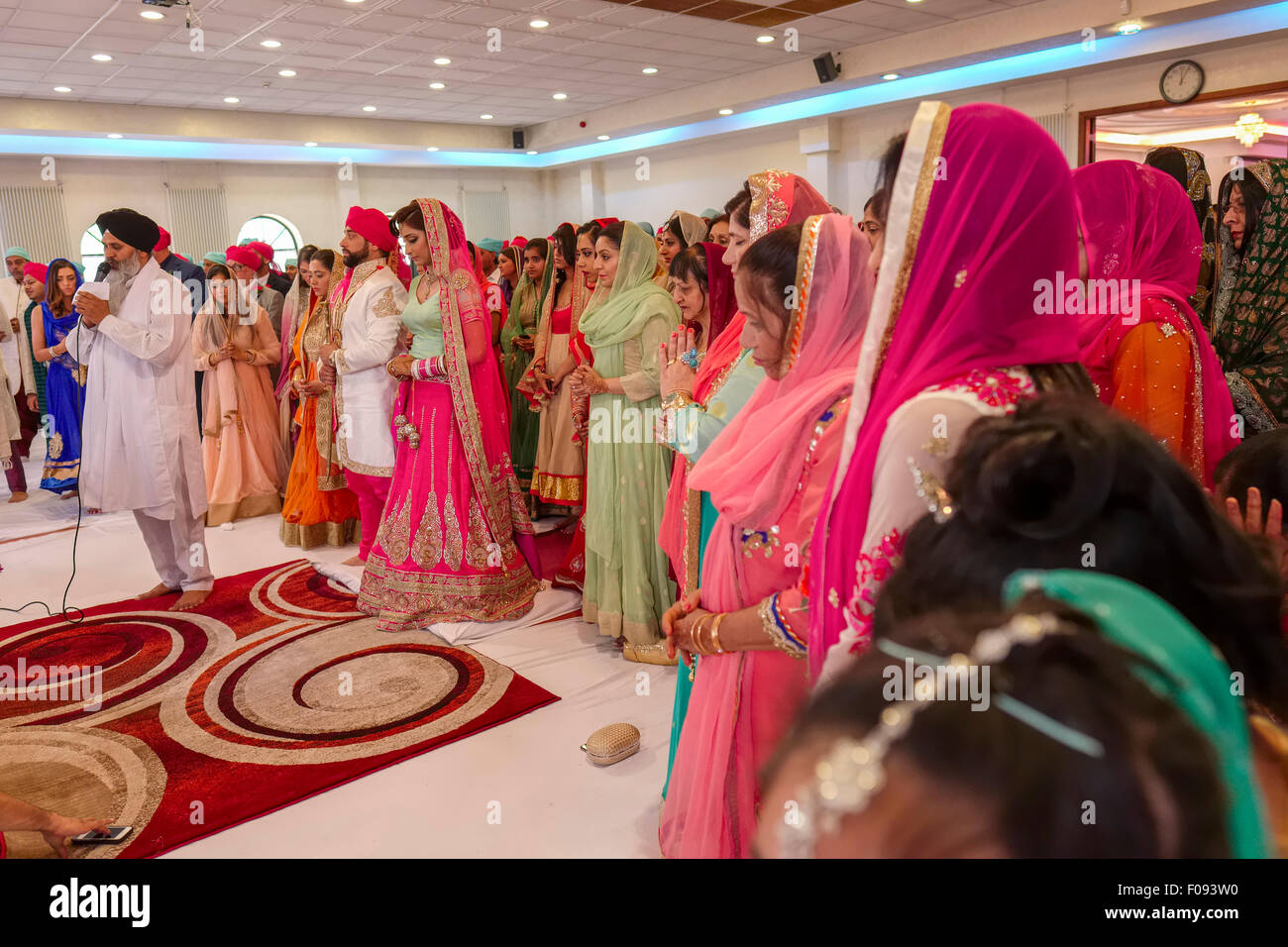 Priest with Bride and Groom at Sikh Wedding Ceremony in Brent Gurdwara ...