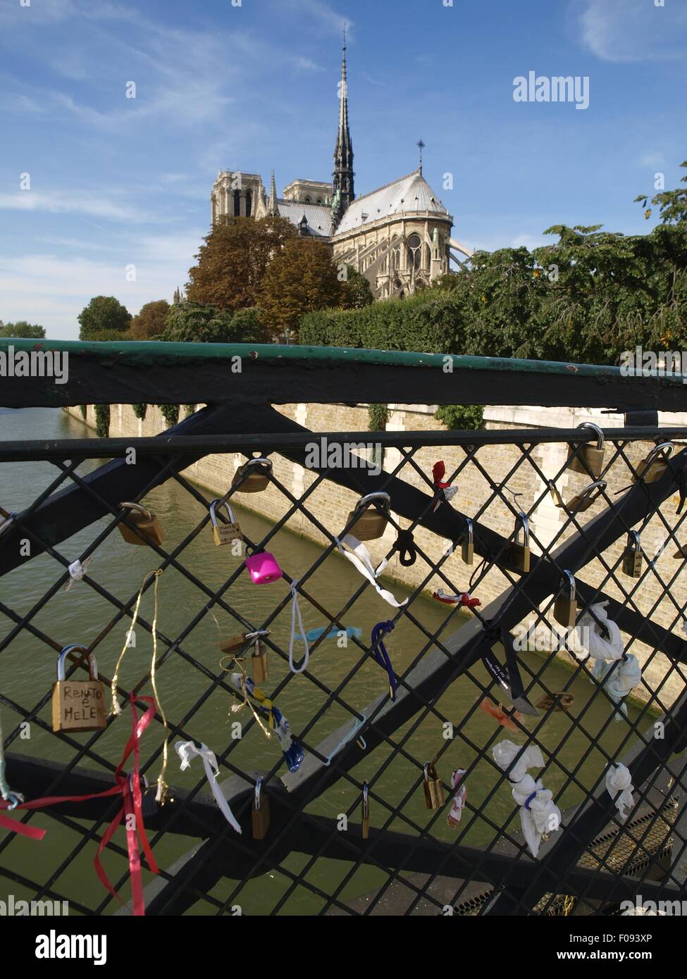 Bridge with love castles overlooking Notre Dame cathedral, Paris ...