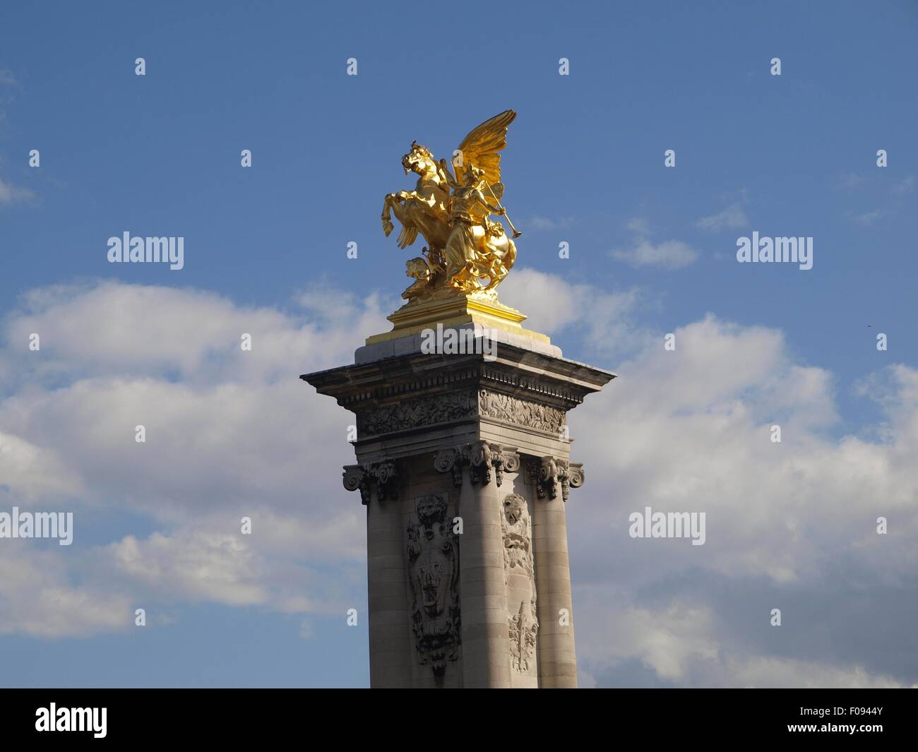 Statue at top of the column at Pont Alexandre III bridge, Paris, France ...