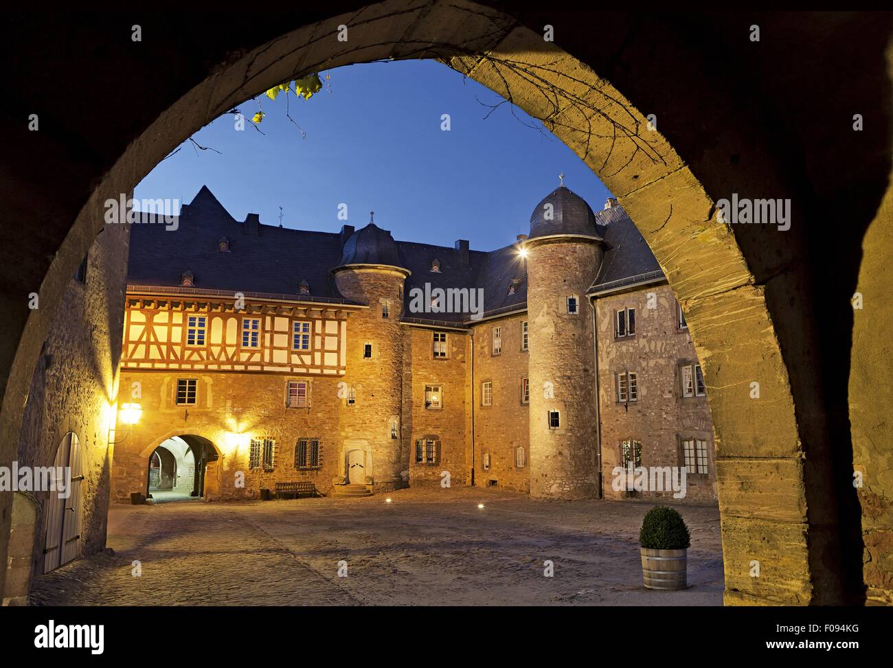 Illuminated Steinau castle at dusk in Hanau, Hesse, Germany Stock Photo ...