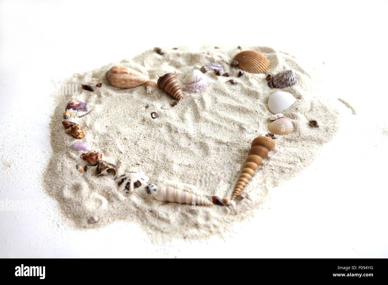 Heart made shells on beach hi-res stock photography and images - Alamy