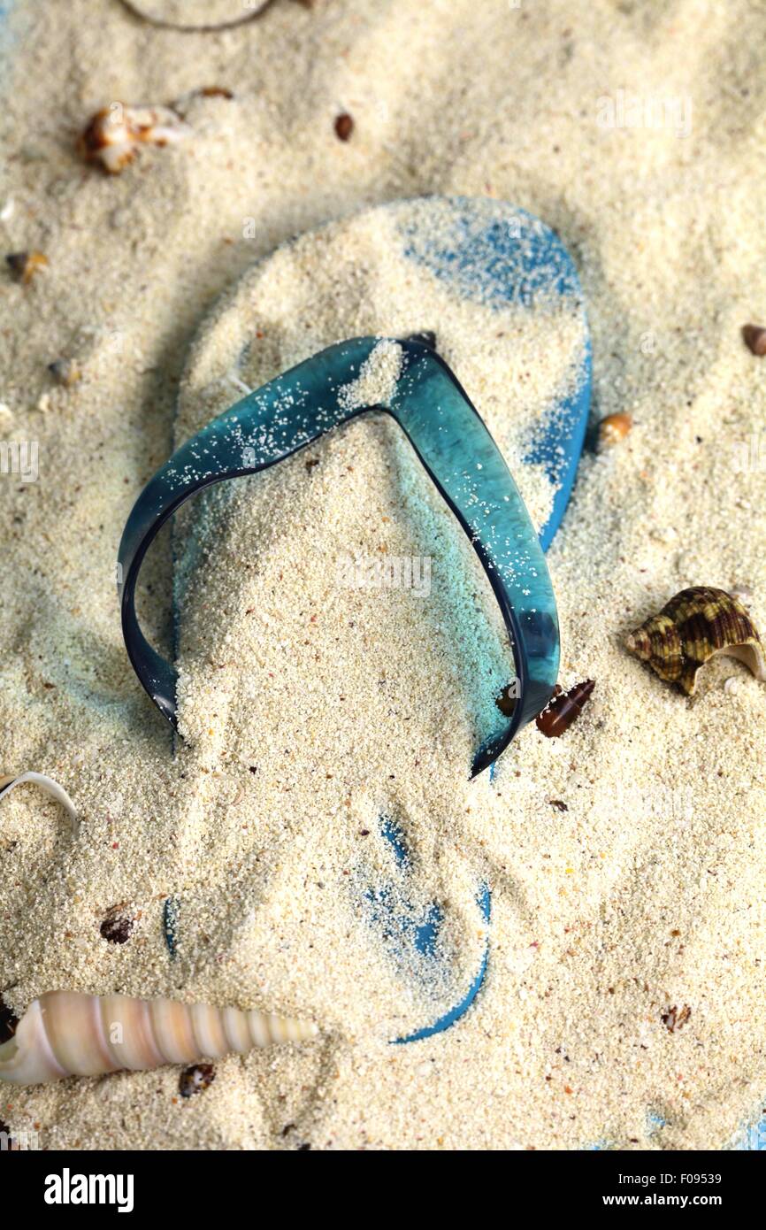Close-up of flip flops in the sand Stock Photo - Alamy