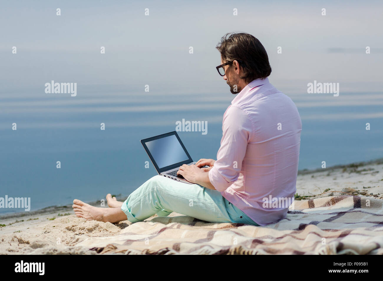 Writer with laptop Stock Photo - Alamy