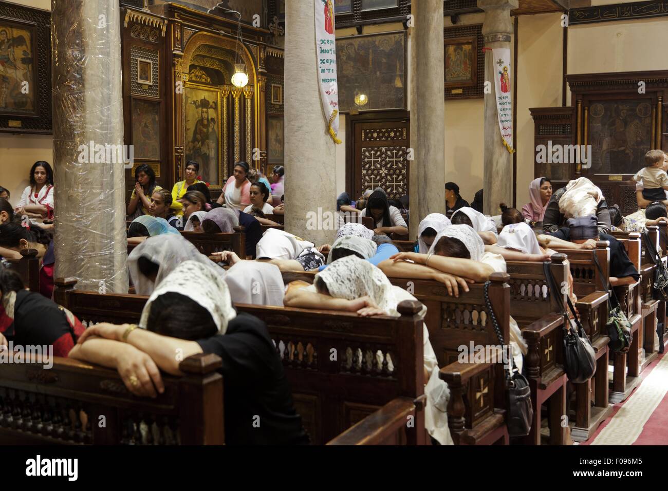 Women praying at Saint Mark's Coptic Orthodox Cathedral, Cairo, Egypt ...