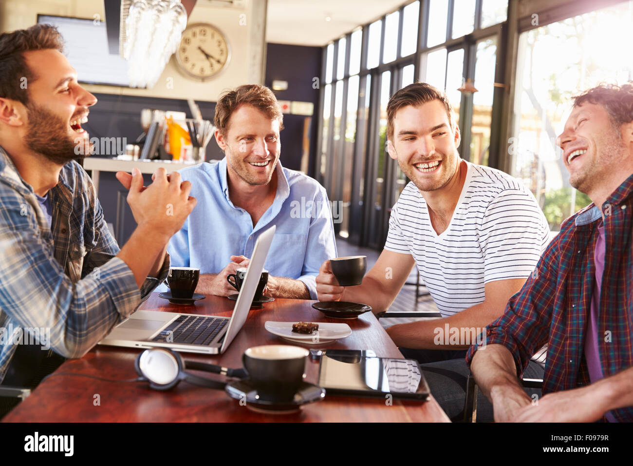Men having fun at a coffee shop Stock Photo - Alamy