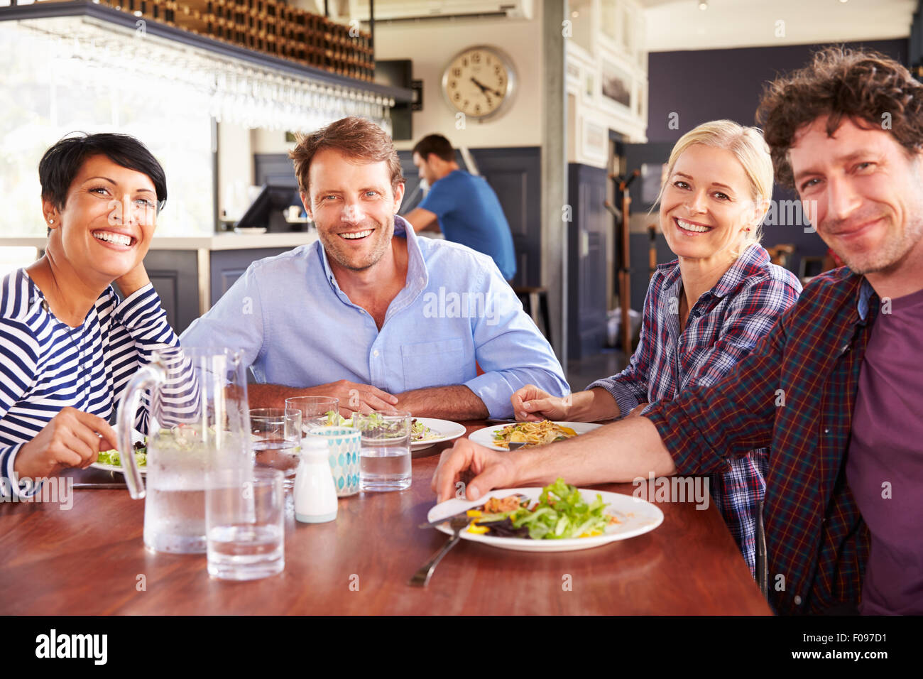 A group of friends having lunch in a restaurant Stock Photo - Alamy