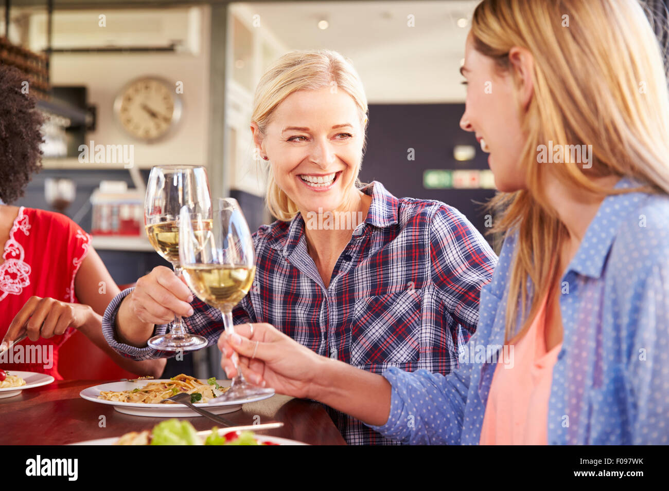 Two female friends at a restaurant Stock Photo - Alamy