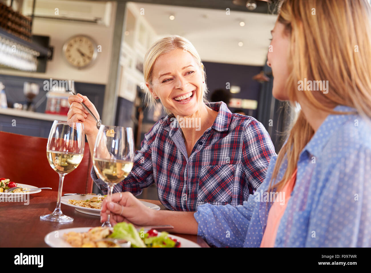 Two female friends at a restaurant Stock Photo - Alamy