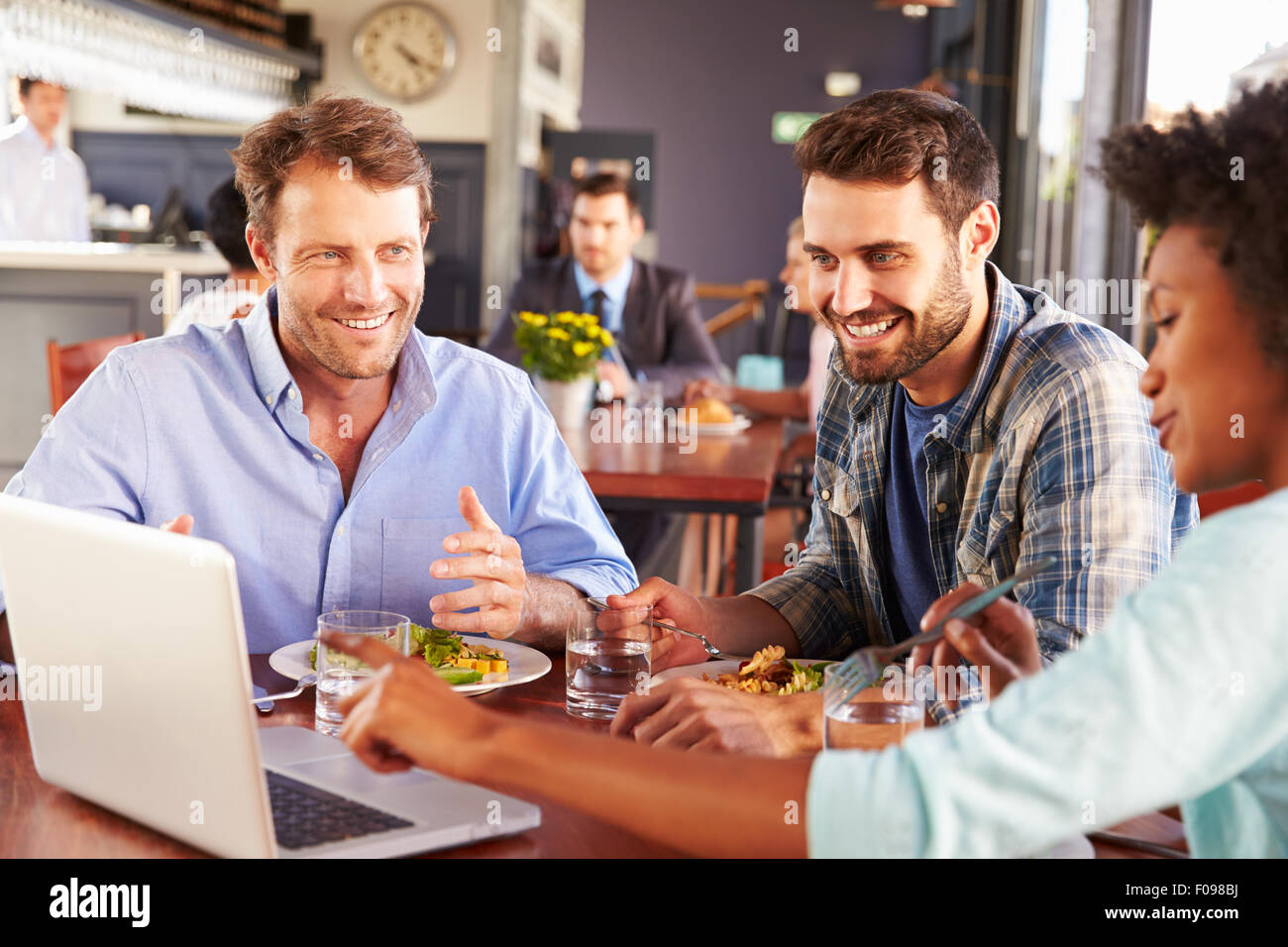 Group of friends at lunch in a restaurant Stock Photo - Alamy