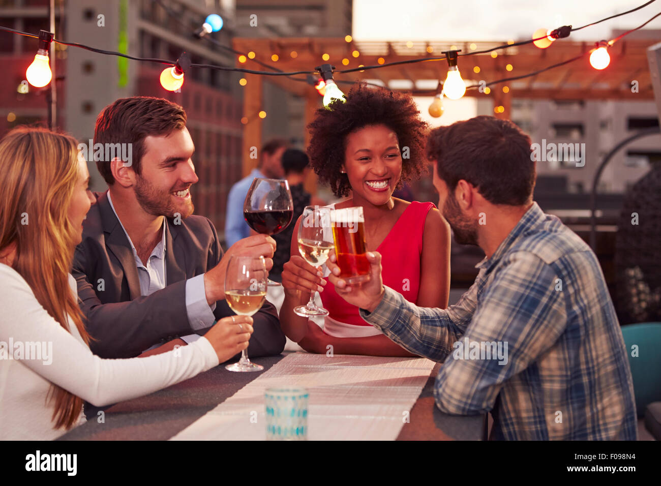 Group of friends at rooftop party Stock Photo - Alamy