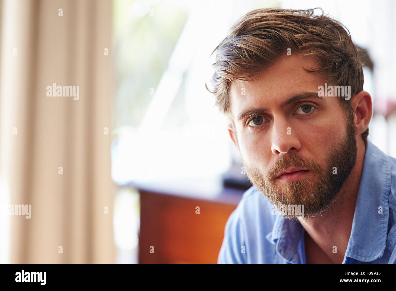 Portrait of a serious young men Stock Photo - Alamy
