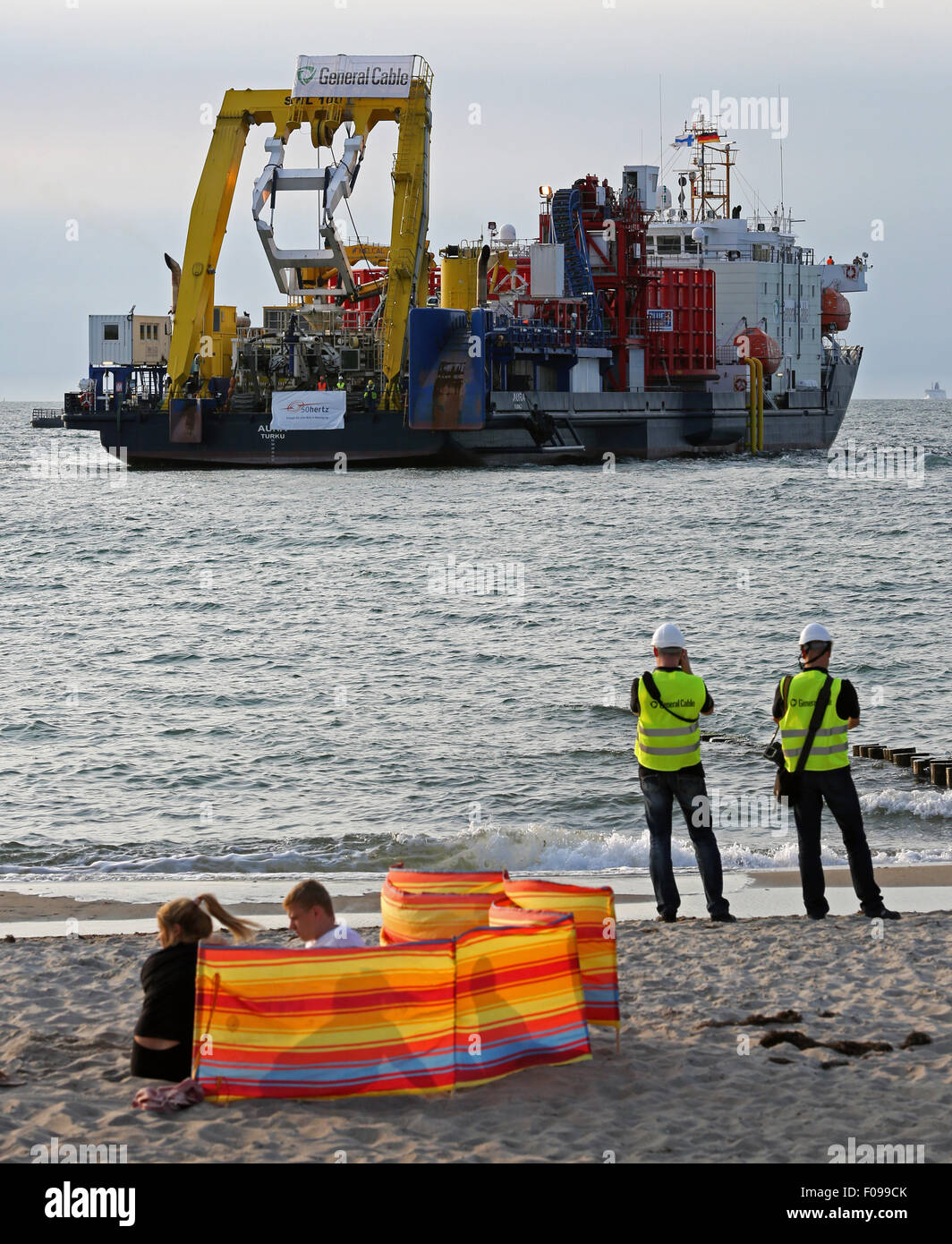 Rostock, Germany. 10th Aug, 2015. An undersea cable is docked to ...