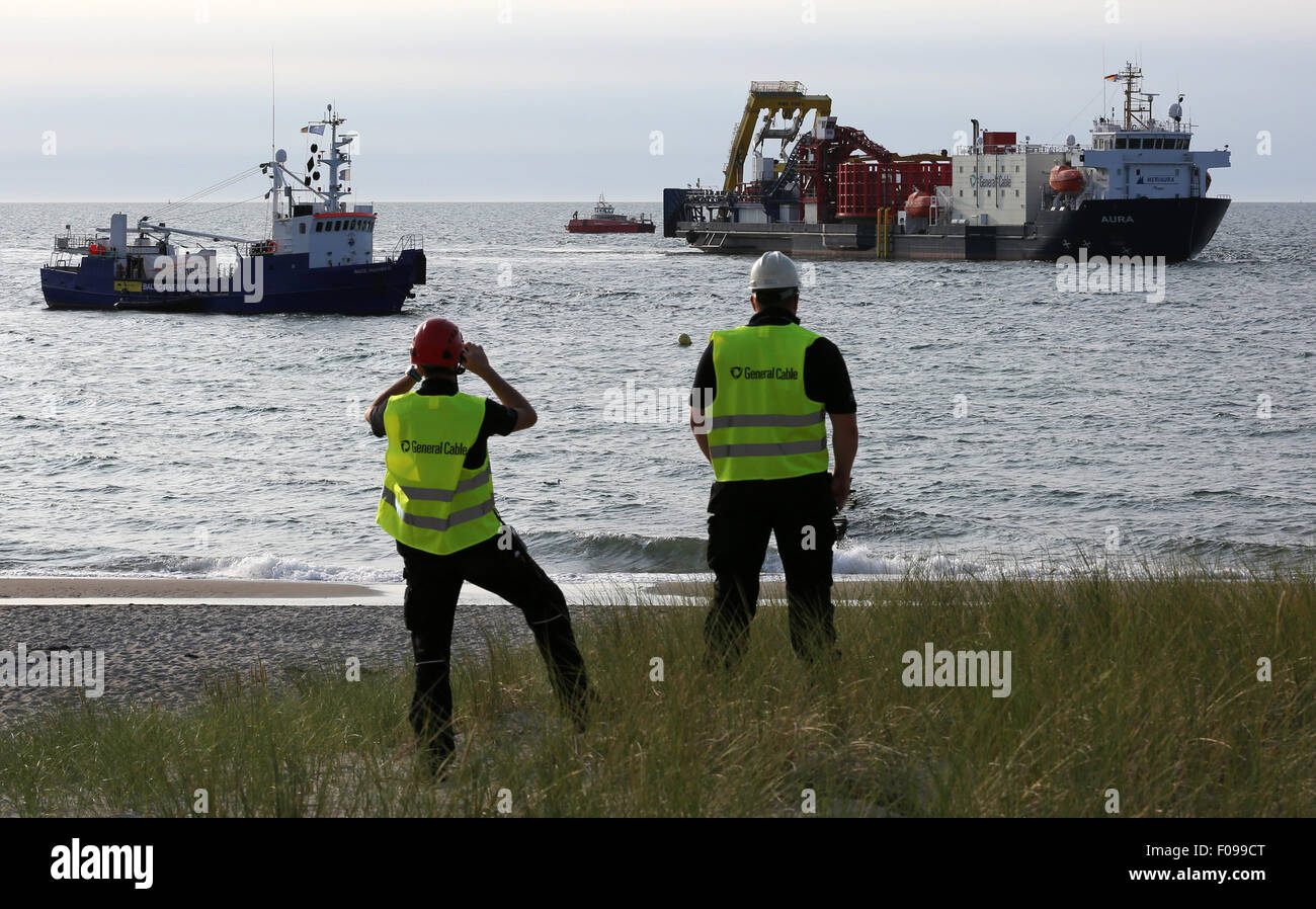 Rostock, Germany. 10th Aug, 2015. An undersea cable is docked to ...