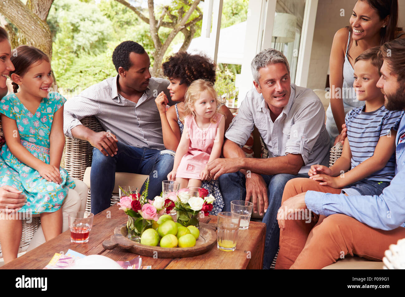 Family gathering in a conservatory Stock Photo - Alamy