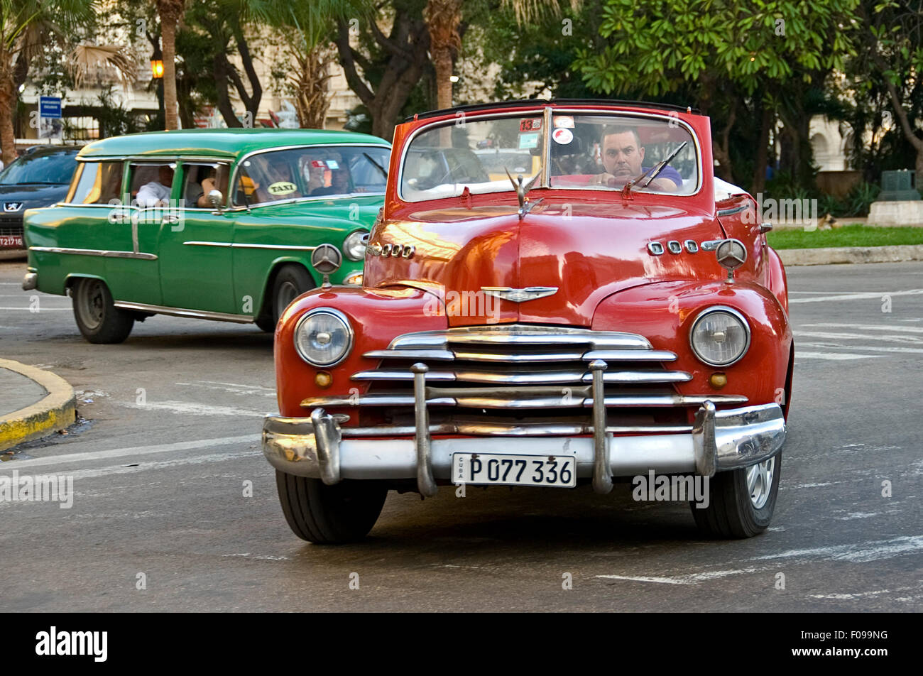 Cars drive down local road hi-res stock photography and images - Alamy