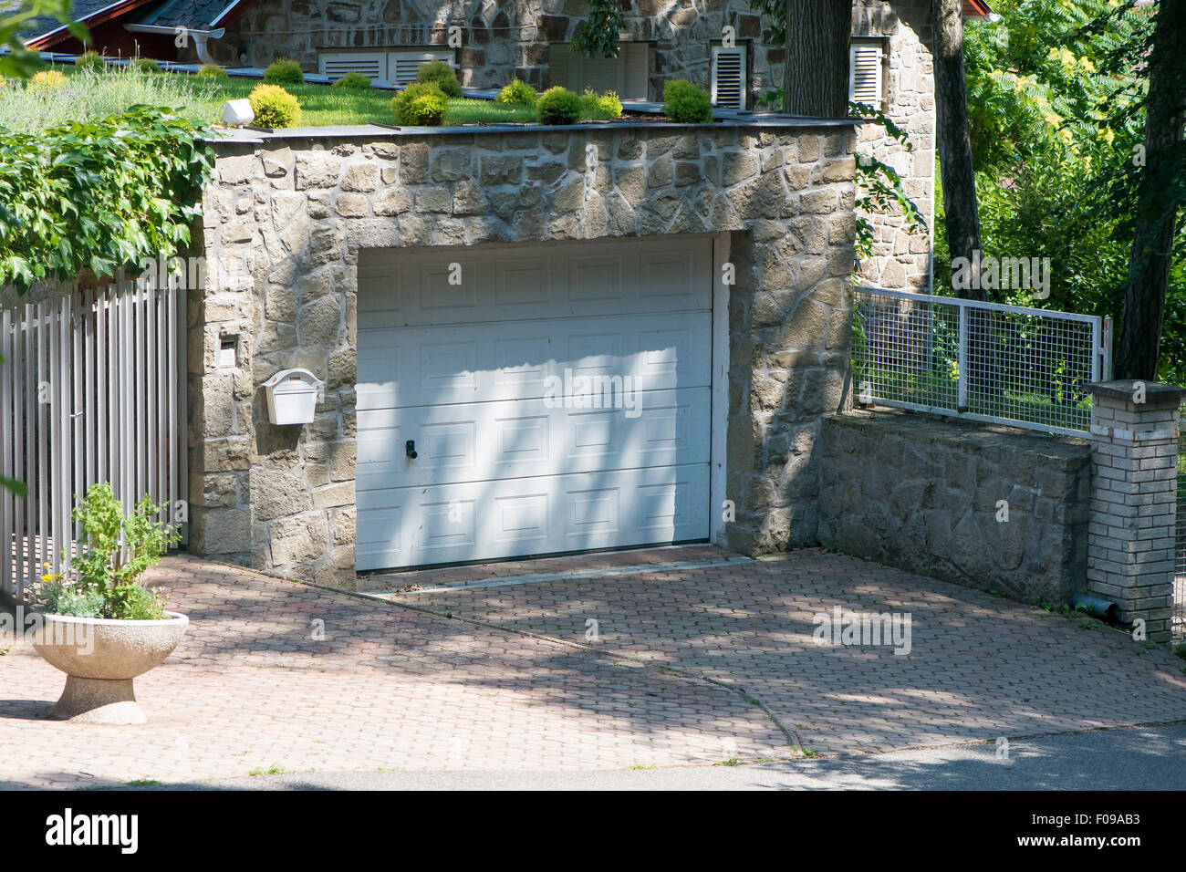 stone garage with grass on the roof Stock Photo - Alamy
