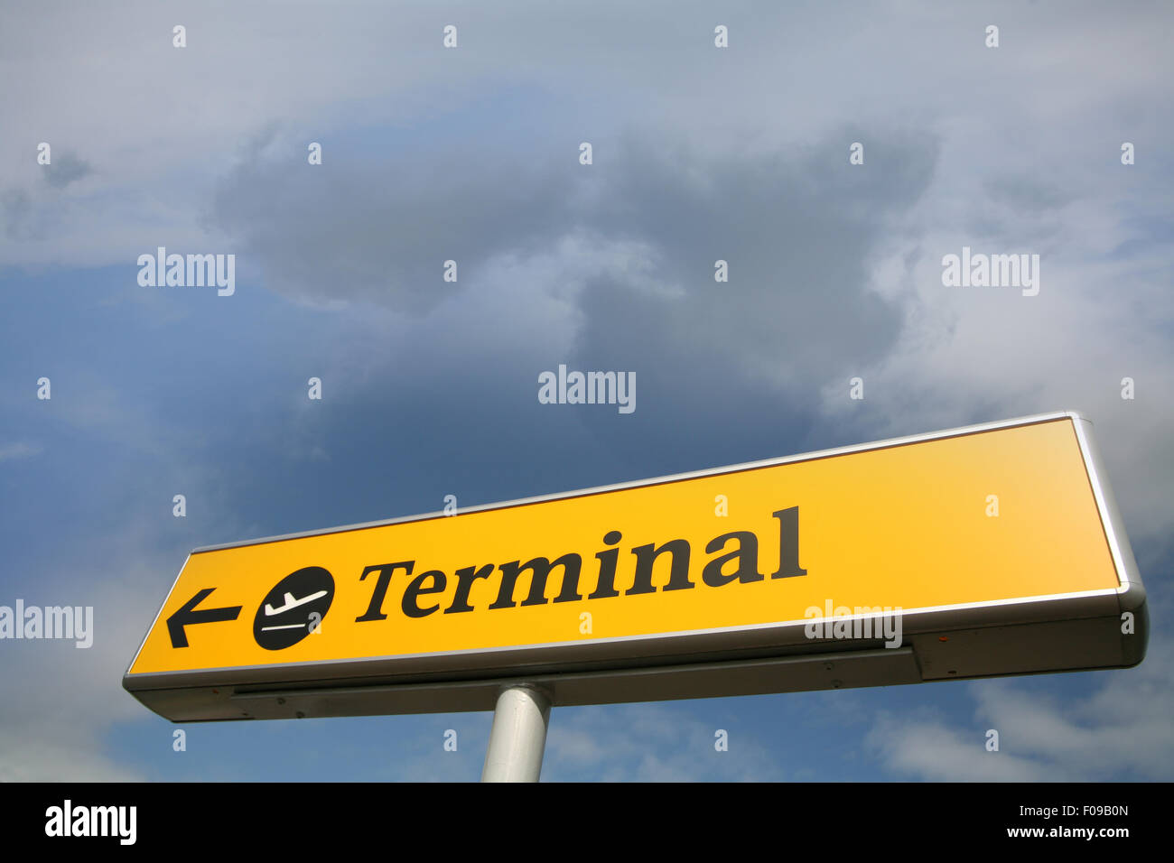 airplane terminal sign in a blue sky with nice cloud formation Stock ...