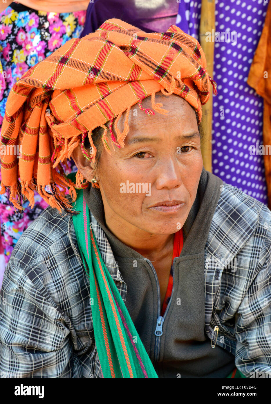 Pa-O woman market trader wearing the traditional orange plaid turban ...