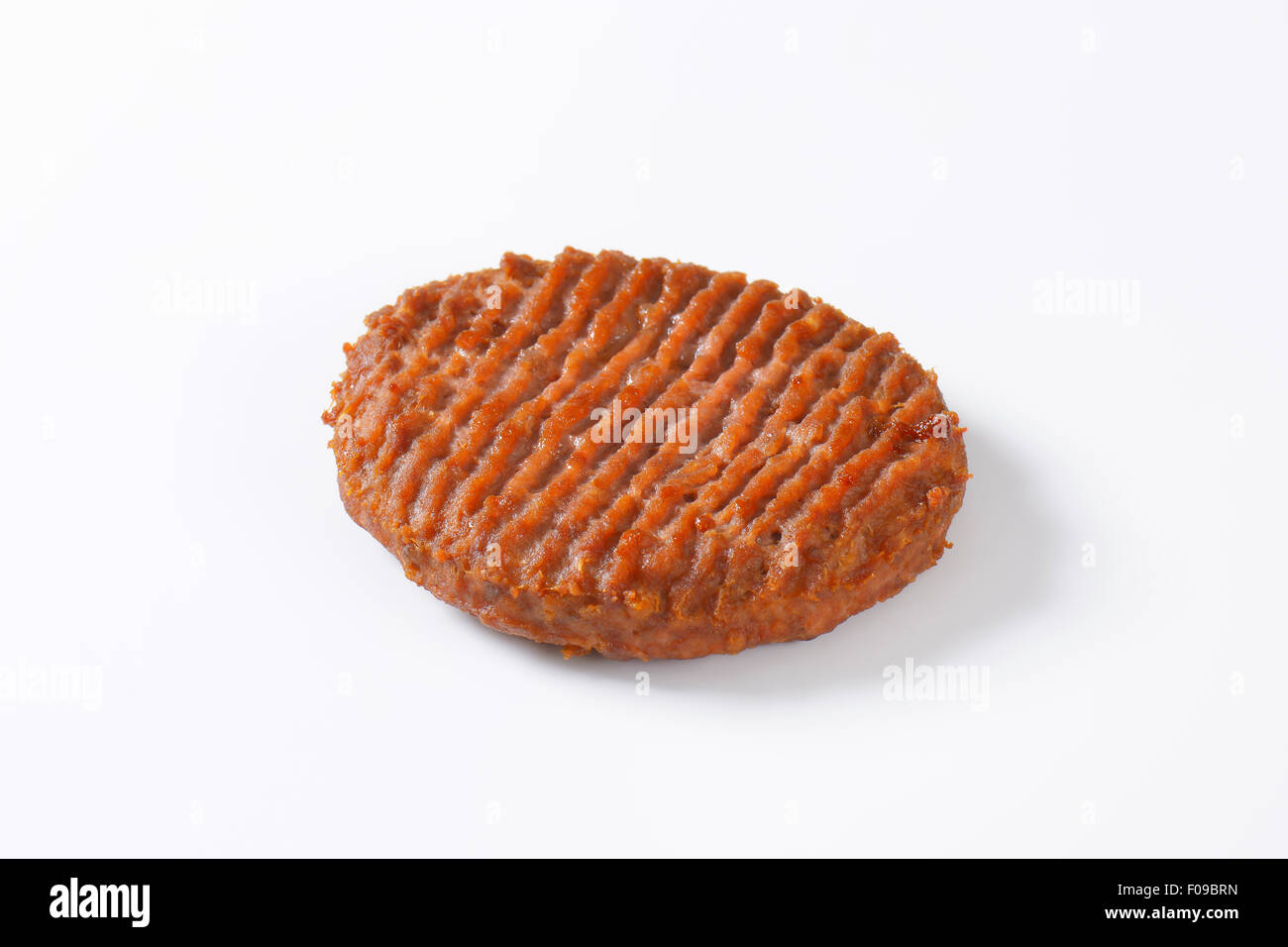 Single Grilled Beef Burger Patty Stock Photo - Alamy