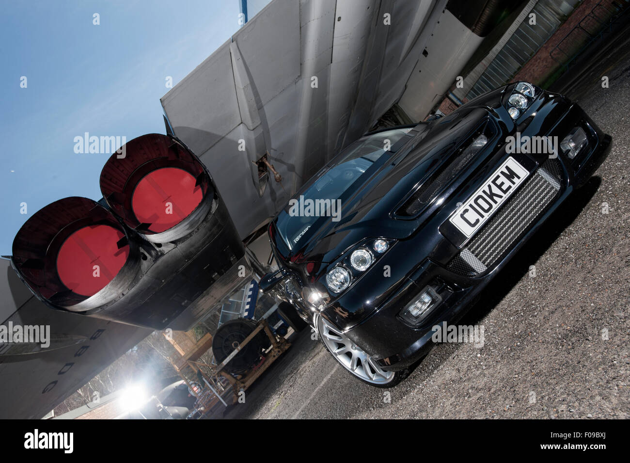 Modified Mk3 Vauxhall Astra car parked under a Concorde airliner Stock ...