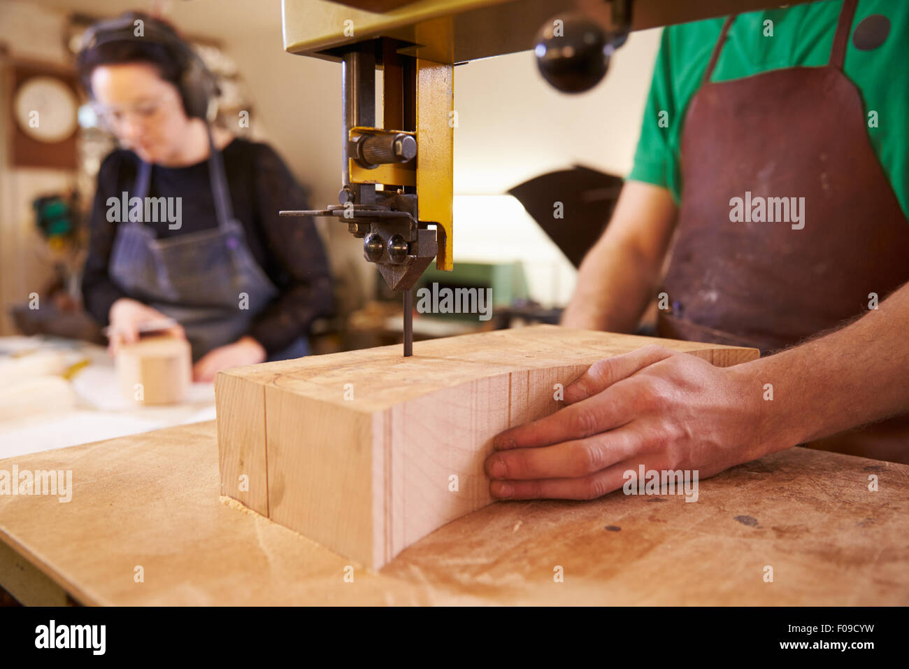 Shoemakers cutting and shaping wood to make shoe lasts Stock Photo - Alamy