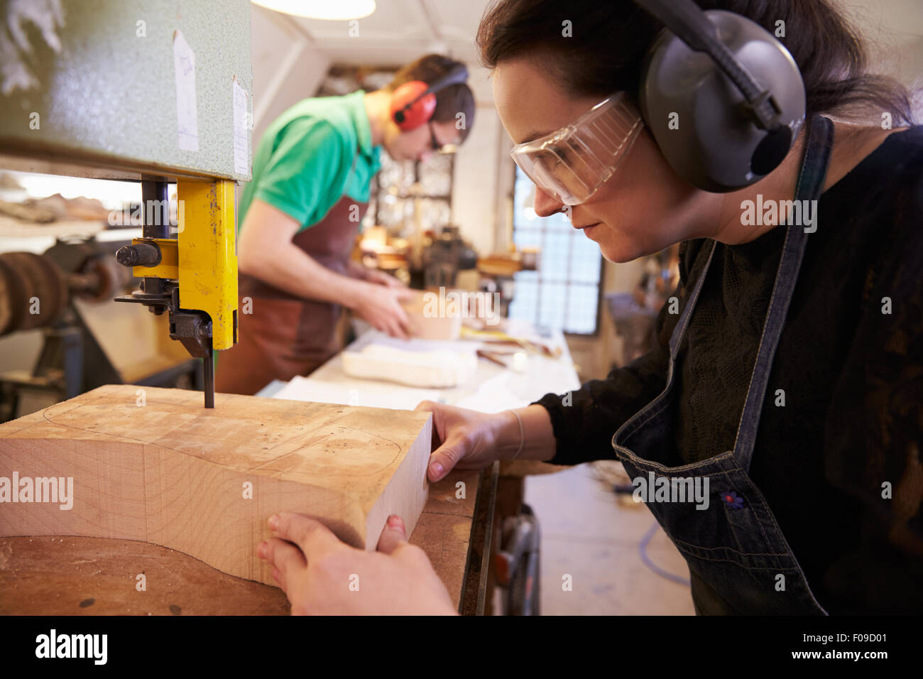 Shoemakers cutting and shaping wood to make shoe lasts Stock Photo - Alamy