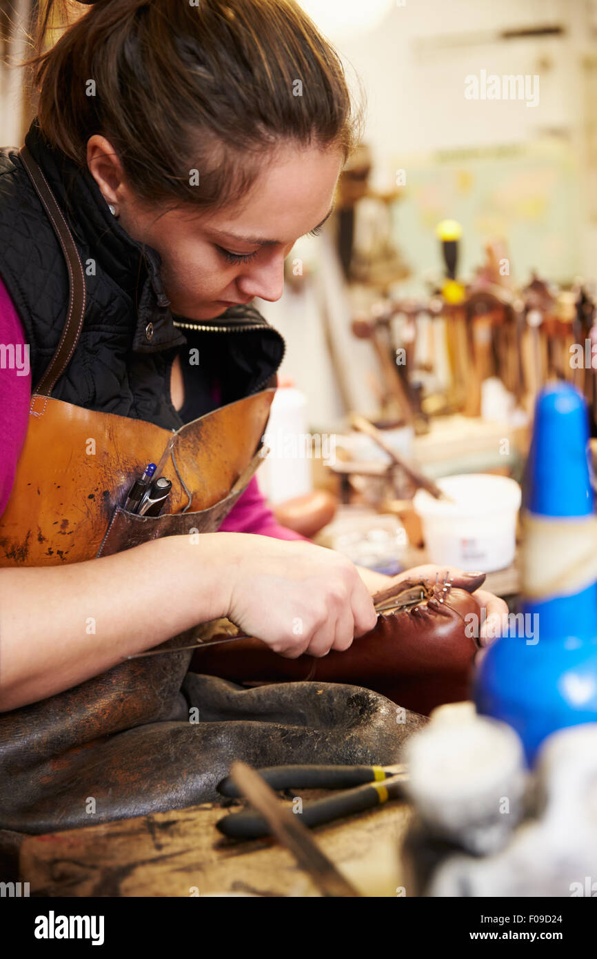 Young shoemaker working with leather in a workshop Stock Photo - Alamy