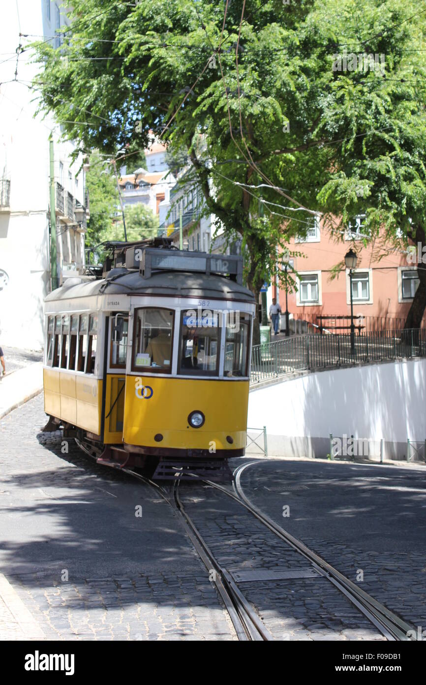 Tram on tracks in Portugal Stock Photo - Alamy