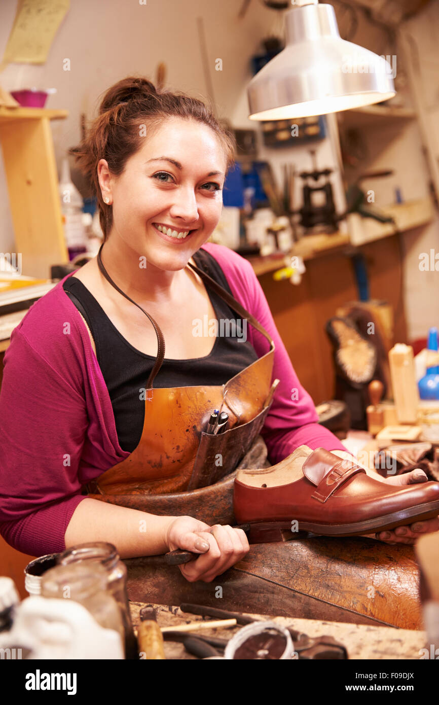 Woman shoemaker making shoes in a workshop Stock Photo - Alamy