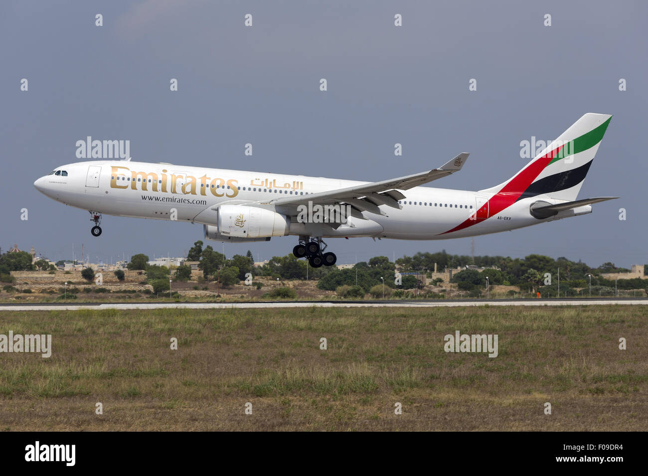 Emirates Airbus A330-200 landing runway 31 Stock Photo - Alamy